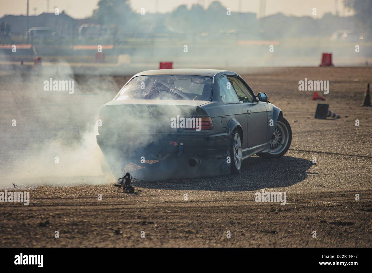 High-octane car drift race captured amidst swirling smoke, showcasing ...