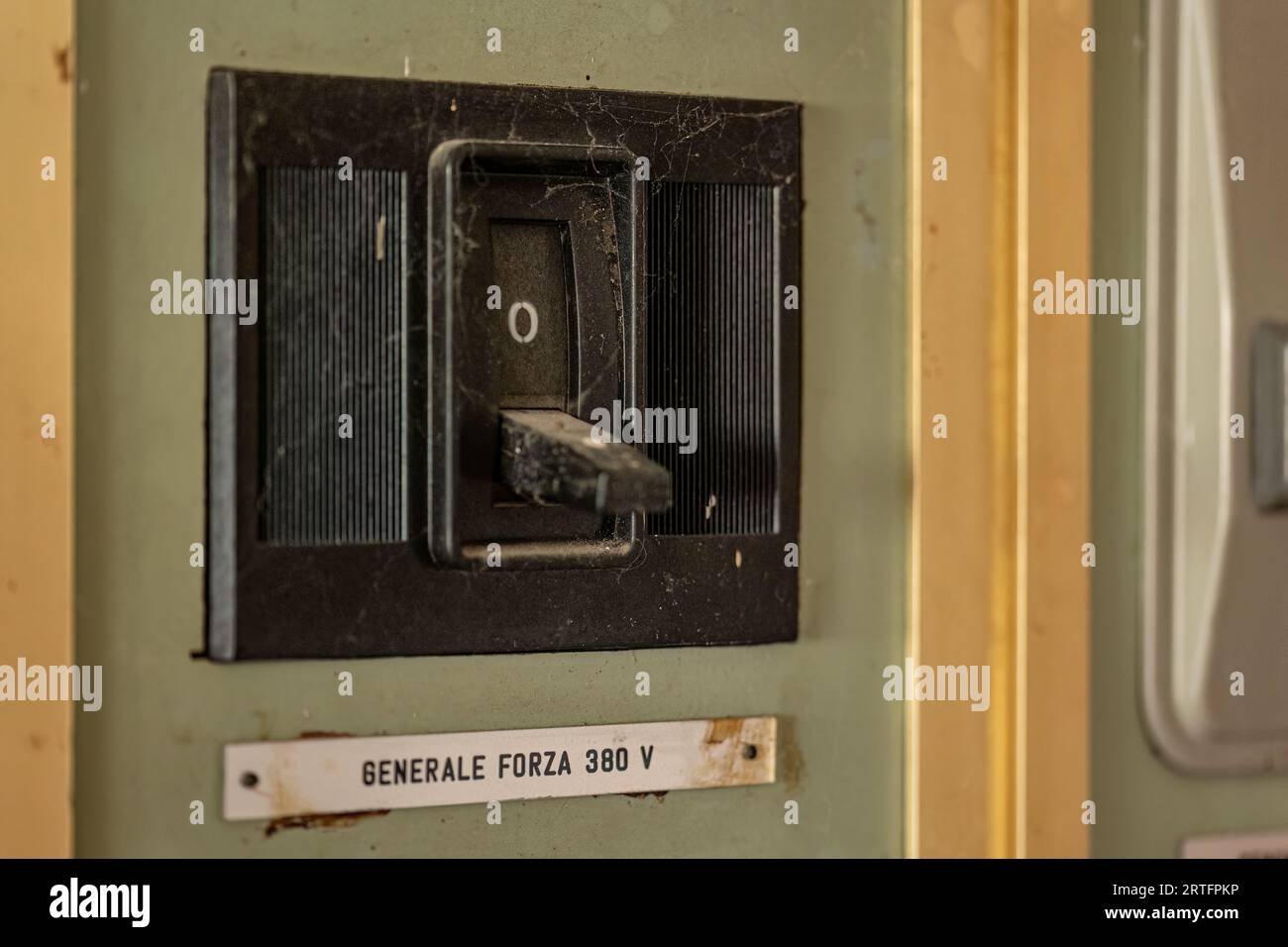Close-up of aged, obsolete high-voltage electrical switches with a ...