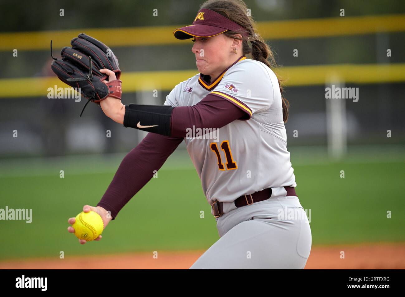 Minnesota pitcher Sydney Schwartz (11) throws during an NCAA college ...