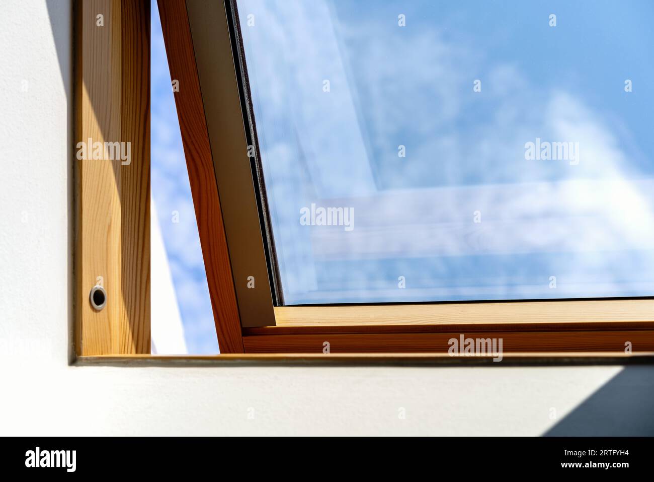 New vertical roof window close up and wooden window frame Stock Photo ...
