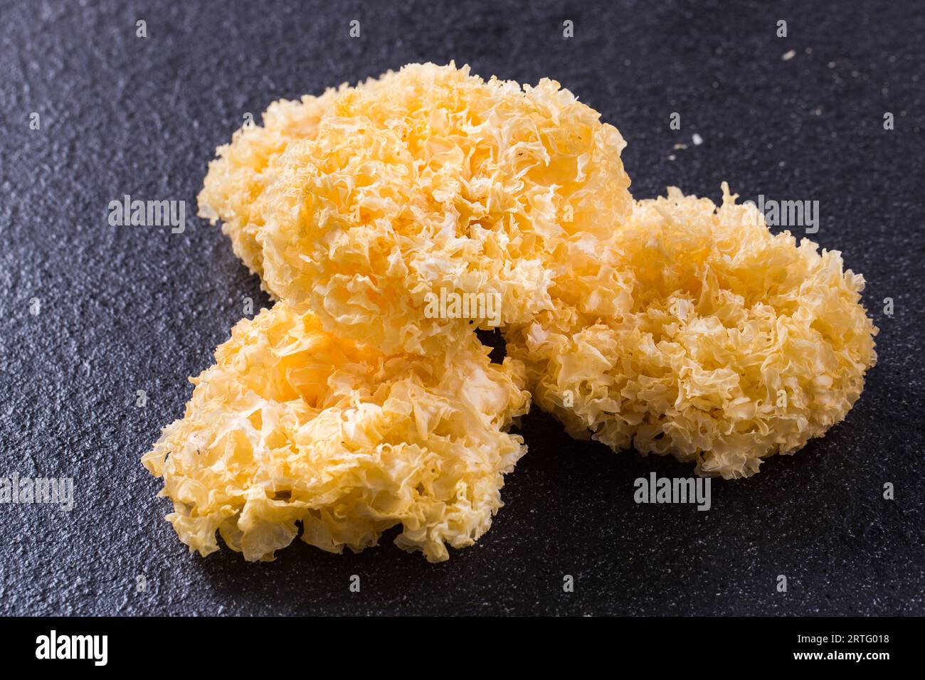 Fresh white fungus (Tremella fuciformis) on a bamboo background Stock ...