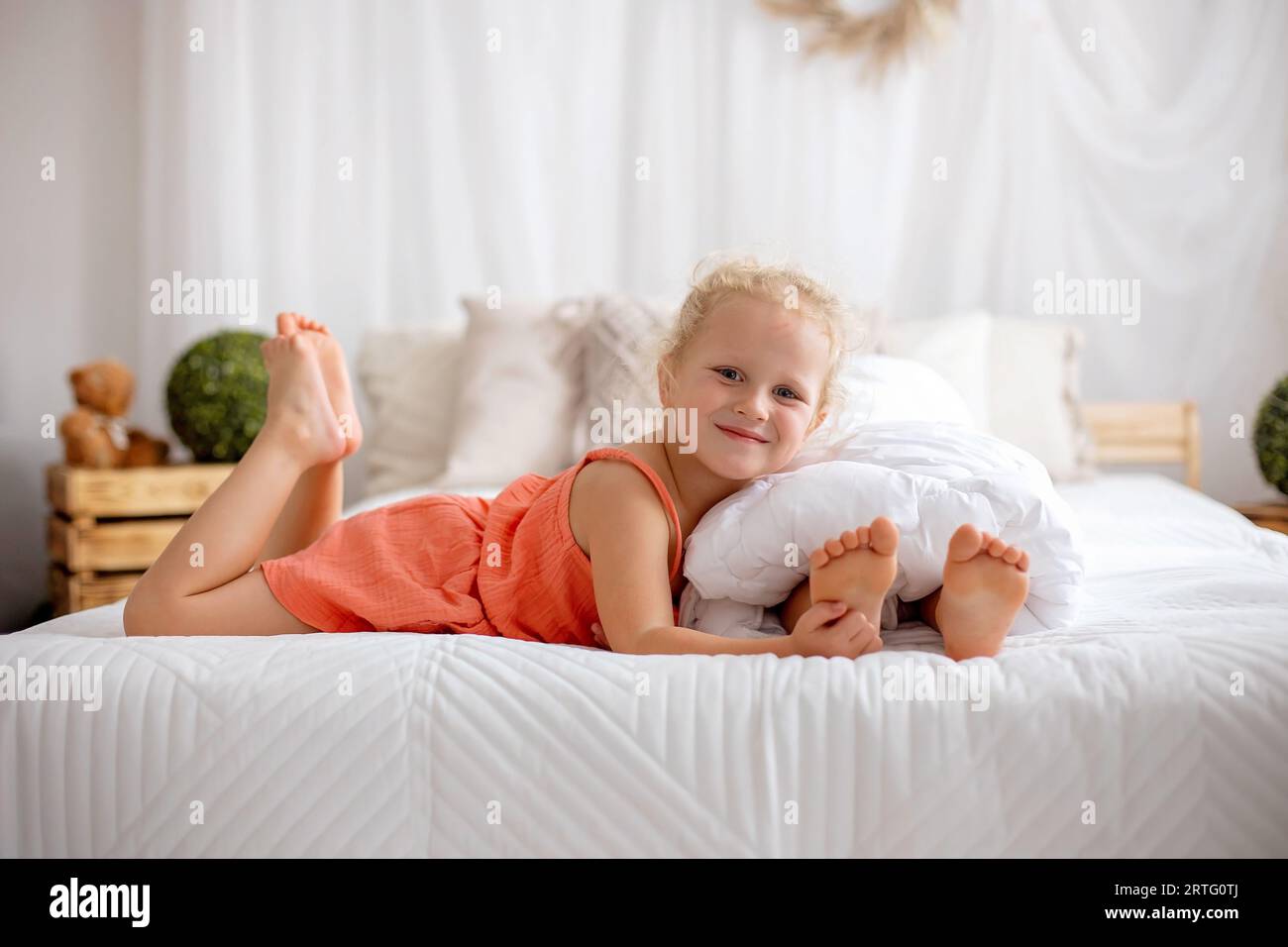 Happy positive children, tickling on the feet, having fun together, boy ...