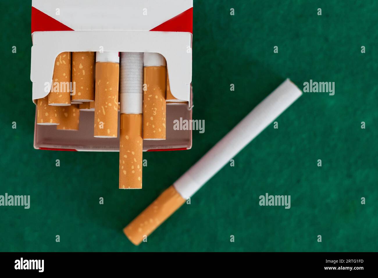 Chaotically laid out cigarettes on a brown matte background Stock Photo ...