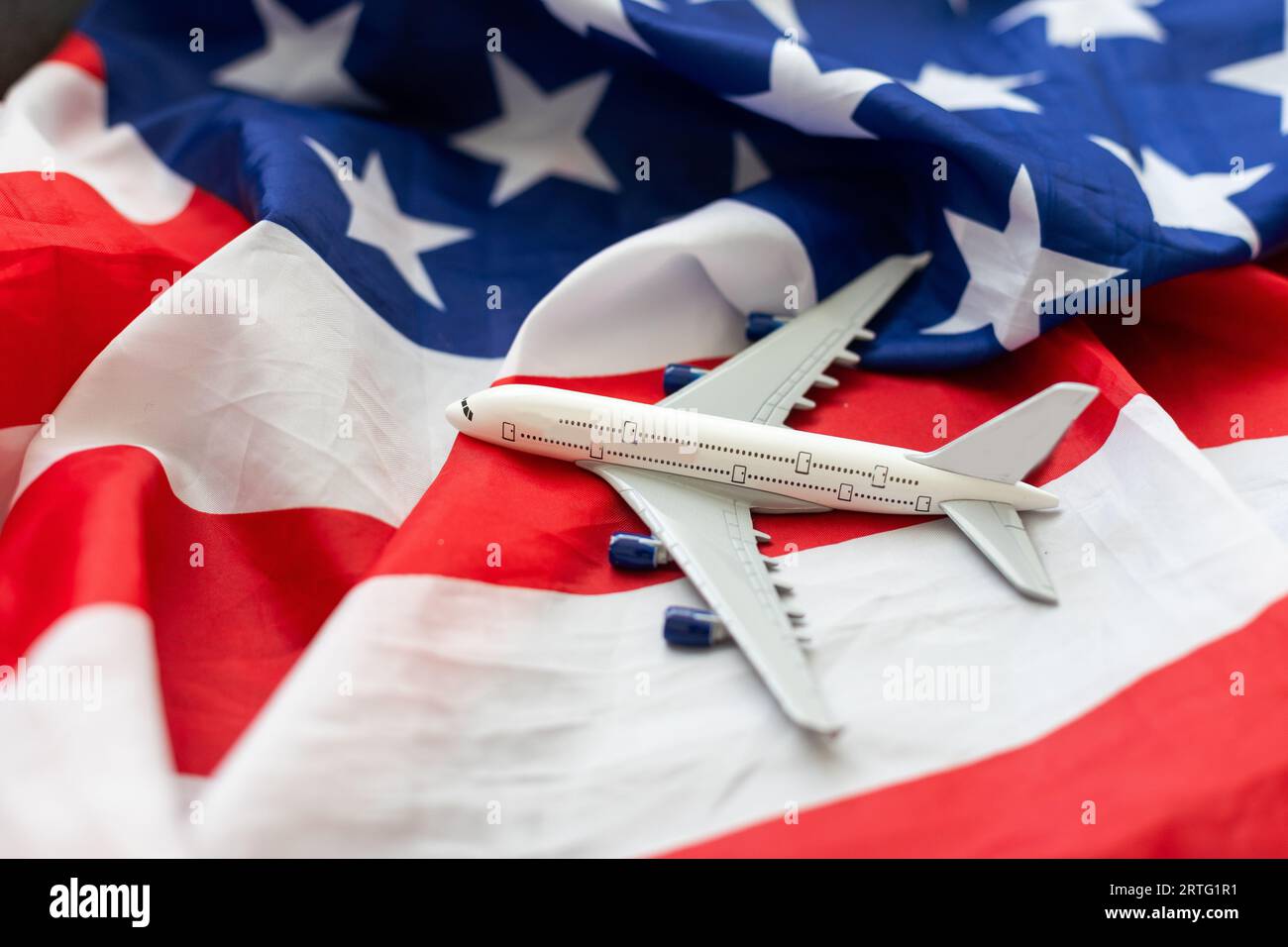 airplane on the usa flag as a symbol of passenger transportation Stock ...