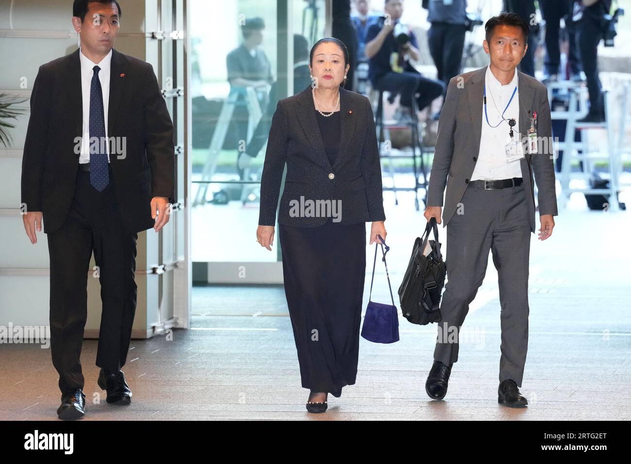 Newly appointed Reconstruction Minister Shinako Tsuchiya, center ...