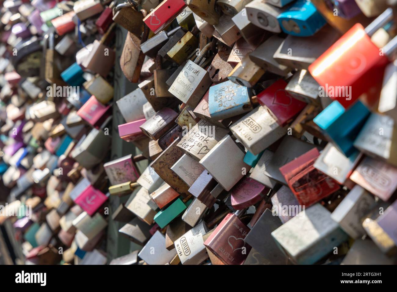 A white brick wall featuring several locks and keys, all arranged in a ...