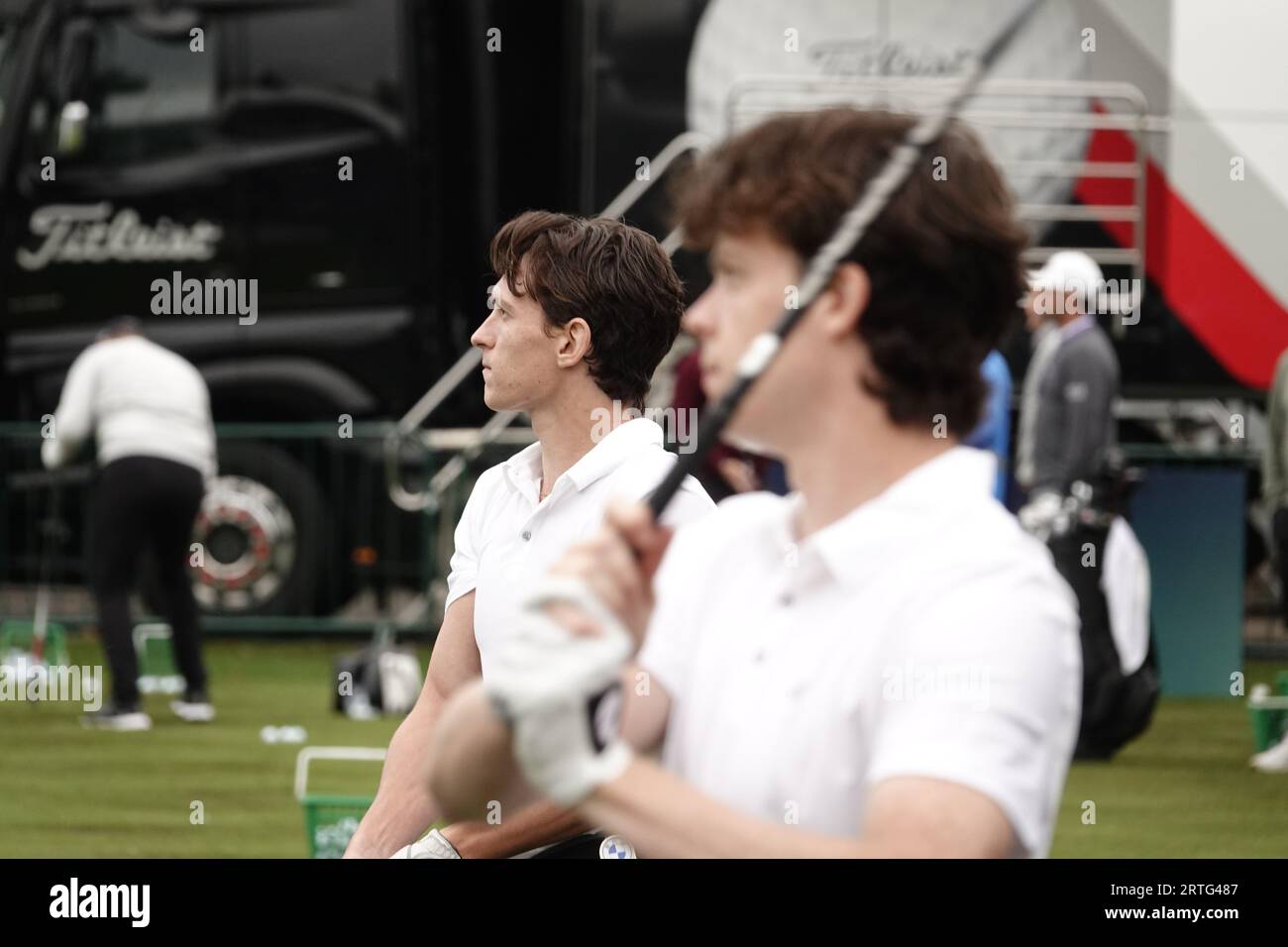 Wentworth, Surrey, UK. 13th Sep, 2023. Actor Tom Holland and his brothers (Harry, Sam) warm up ...