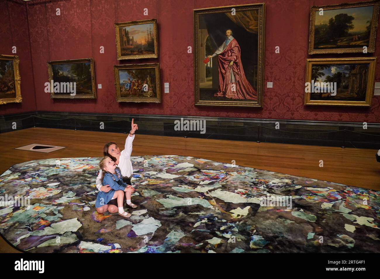 Visitors recline on a floor installation by Celine Condorelli at the ...