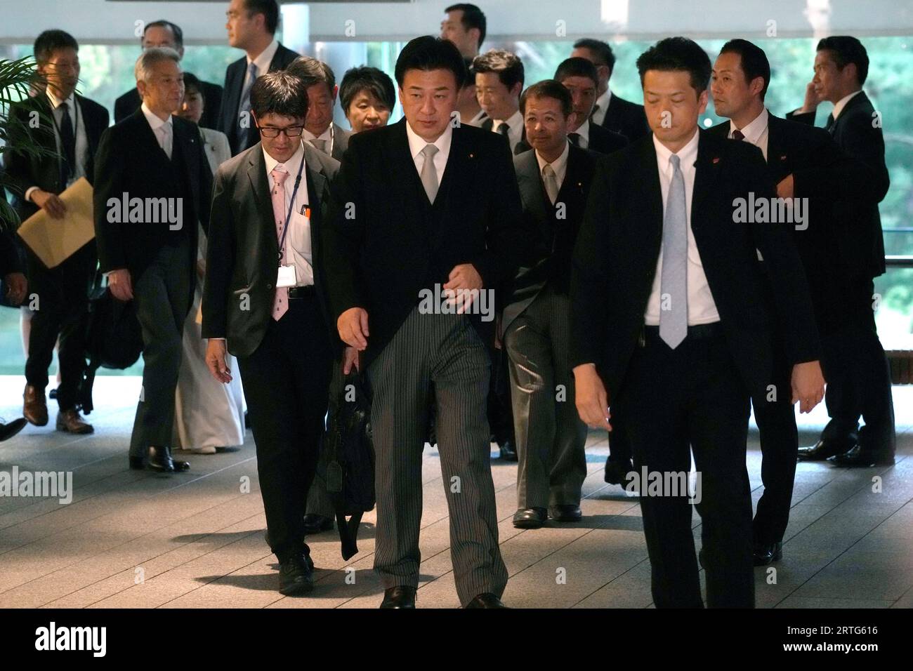 Newly appointed Defense Minister Minoru Kihara, center, and other new ...