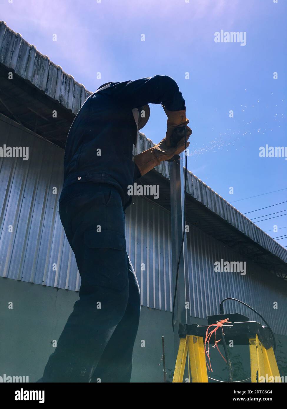 Cutting Metal, Man with cutting steel tool blurred background ...