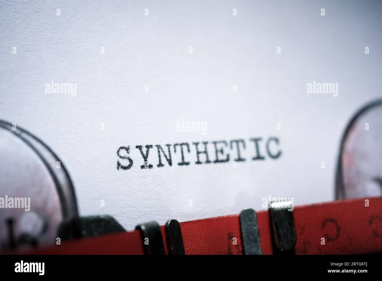Synthetic word written with a typewriter Stock Photo - Alamy