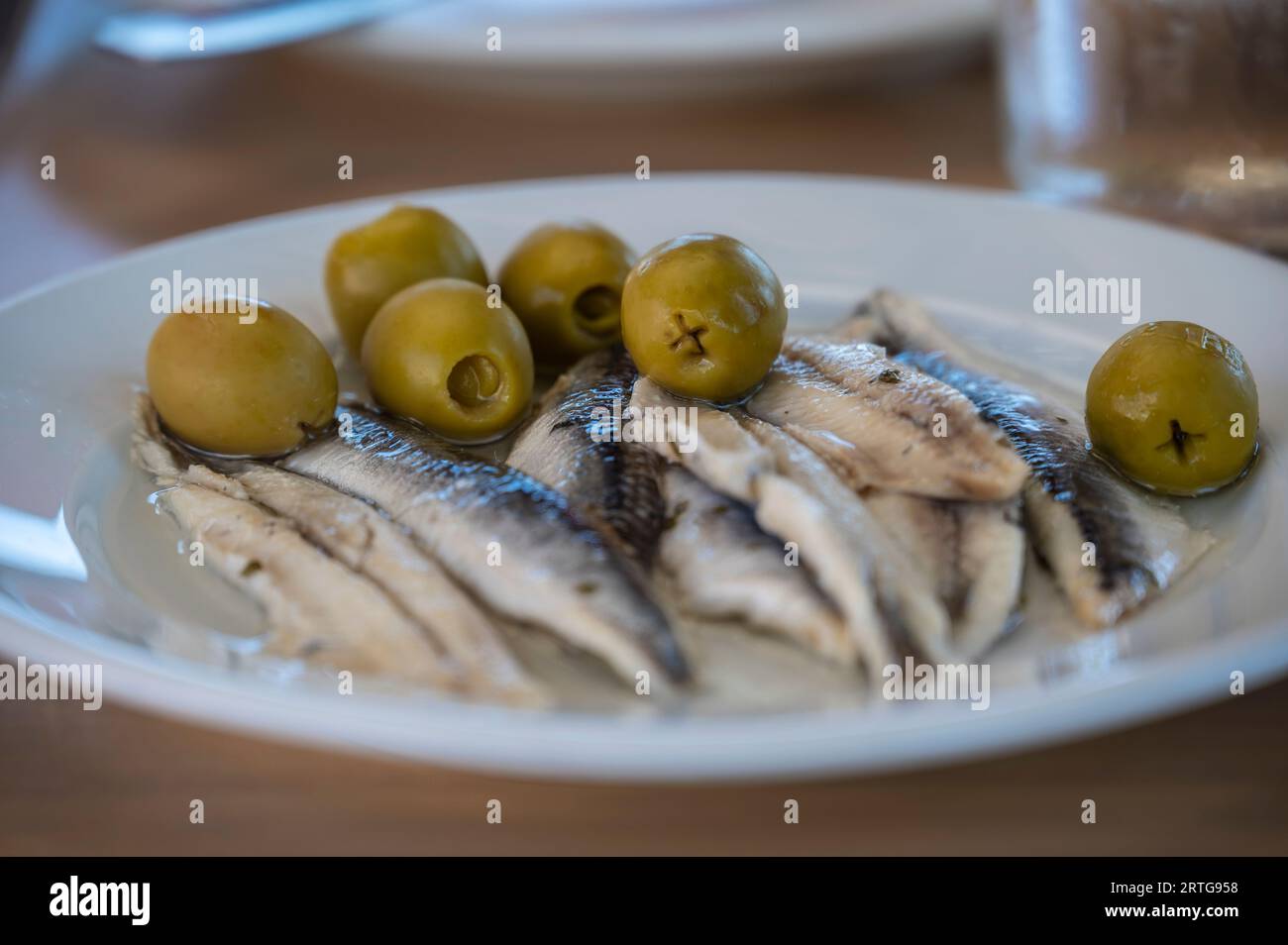 A plate of Anchovies and Olives. A typical tapas dish in Spain Stock ...