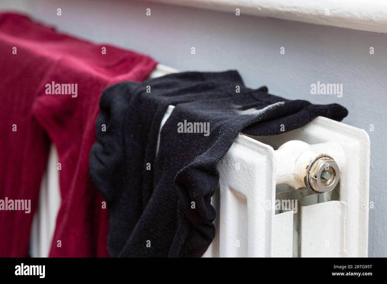 Washing drying on a radiator Stock Photo - Alamy