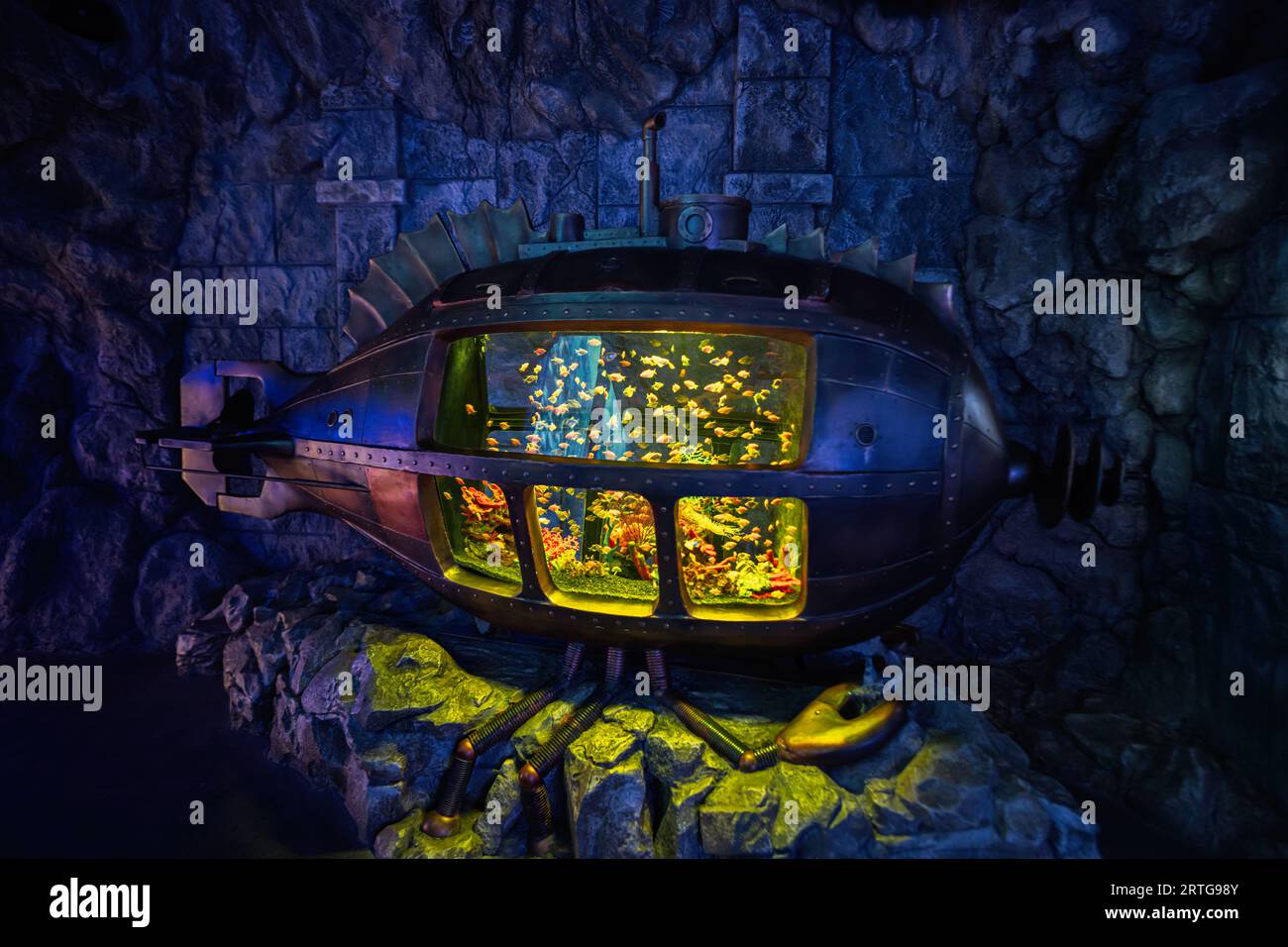 Vintage old underwater submarine with fishes inside at oceanarium ...