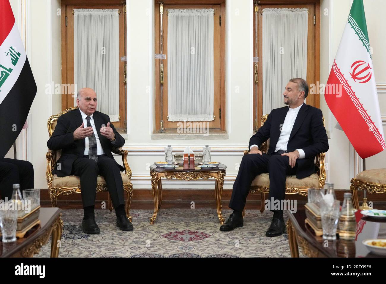 Iraqi Foreign Minister Fuad Hussein, left, speaks during a meeting with ...