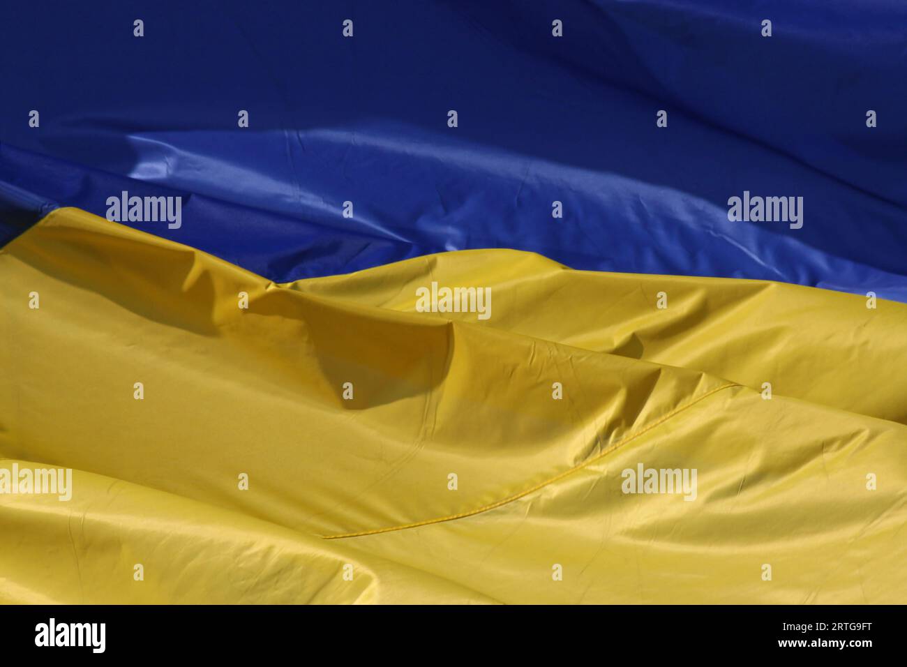 stand with Ukraine: close up of waved flag of Ukraine Stock Photo - Alamy