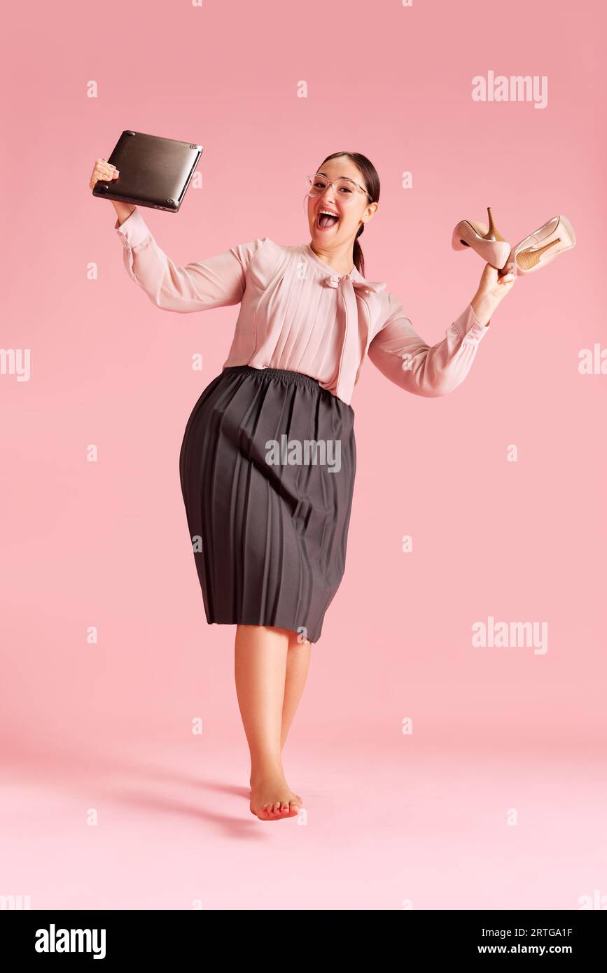 Happy Woman Employee In Formal Wear Taking Her Shoes Off And