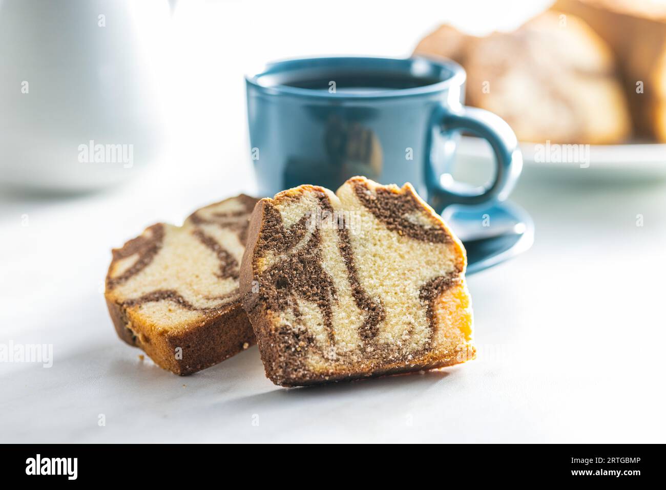 Marble sponge cake and coffee cup. The cake with cocoa and vanilla ...