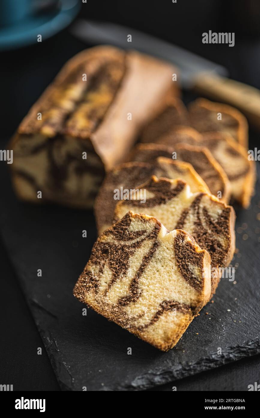 Marble sponge cake. Cake with cocoa and vanilla taste on the cutting ...
