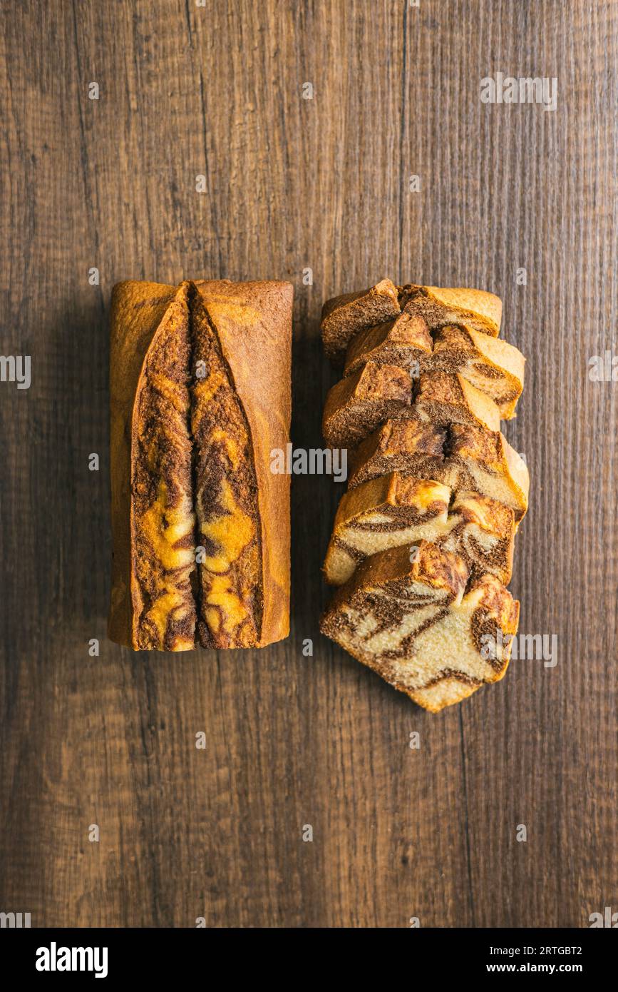 Marble sponge cake. Cake with cocoa and vanilla taste on the wooden ...