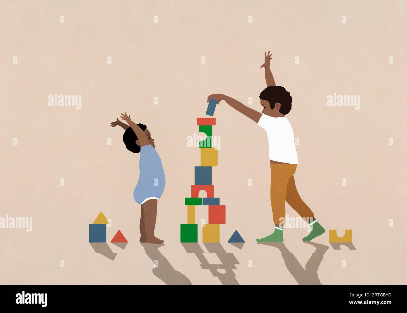 Happy young brothers playing, stacking toy blocks Stock Photo - Alamy