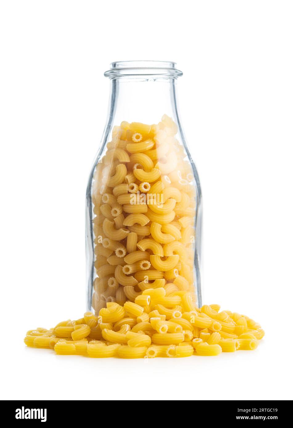 Raw macaroni pasta in glass bottle. Uncooked rigatoni isolated on the ...
