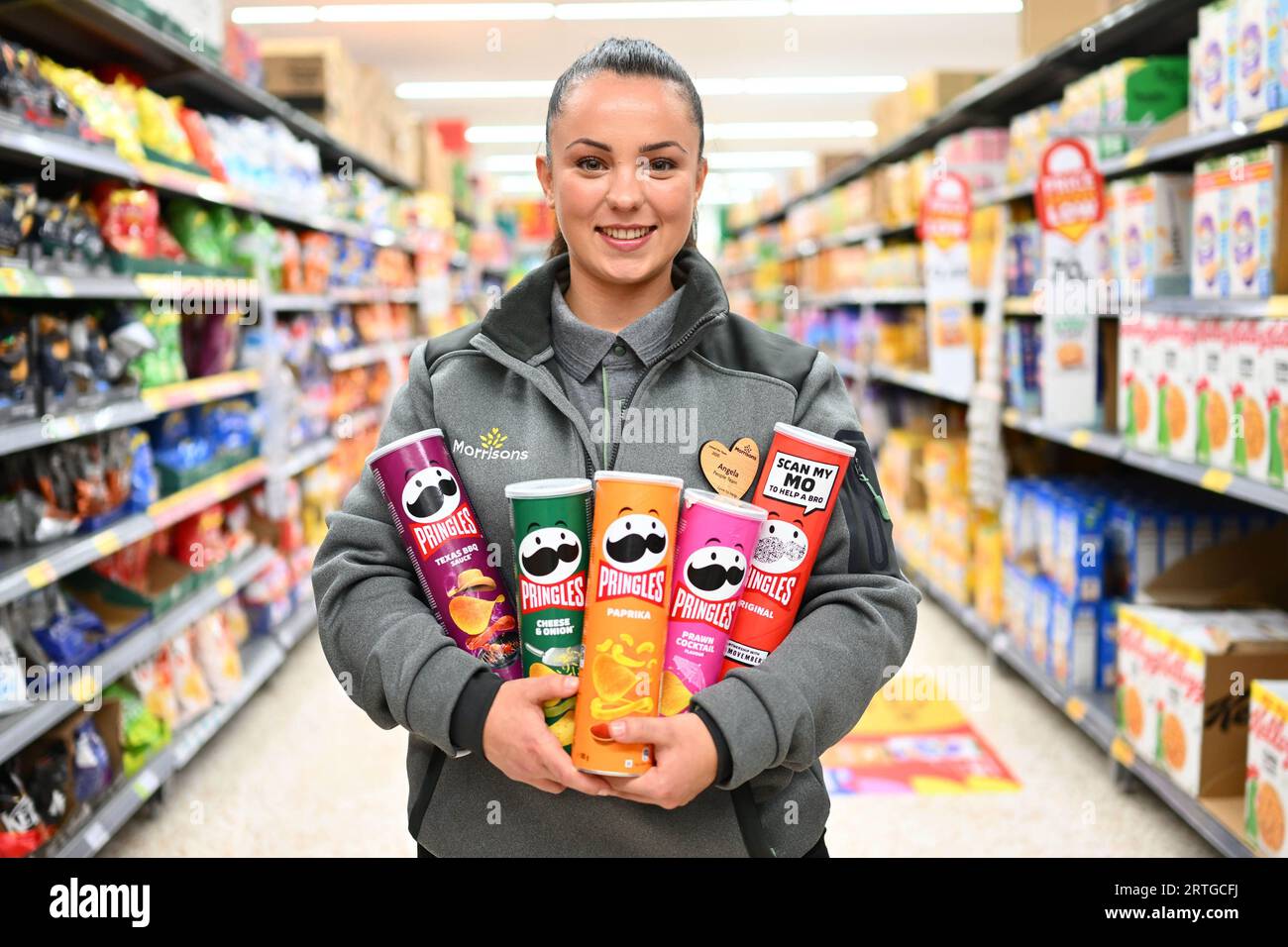 EDITORIAL USE ONLY Team member at Morrisons Stratford, Angela holds ...