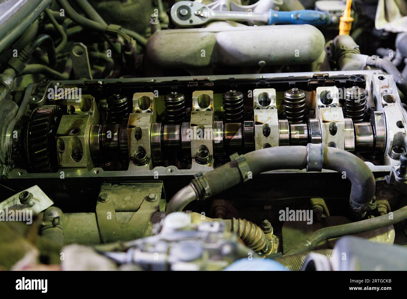 combustion engine of german SUV with removed valve cover and rocker ...