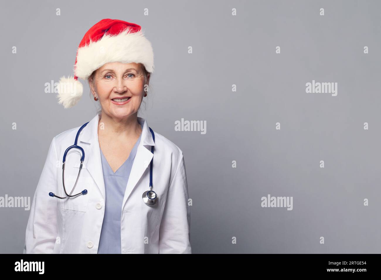 Xmas portrait of Christmas doctor wearing professional medical uniform ...