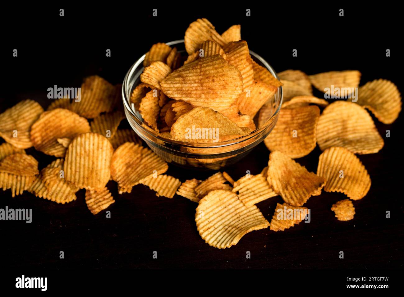 Potatoes Chips. Fried potatoes in a deep transparent bowl, Potato chips ...