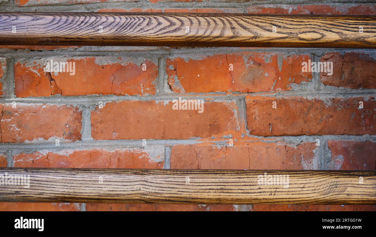 composite background of old red brick with cement joints and wooden ...