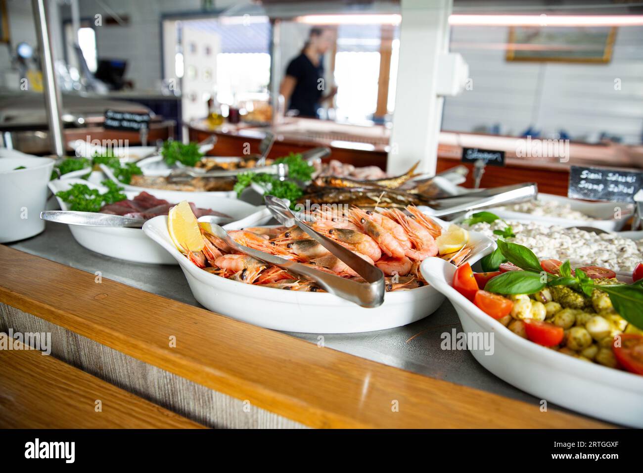 delicious shrimp on a serving plate on the buffet table in the ...