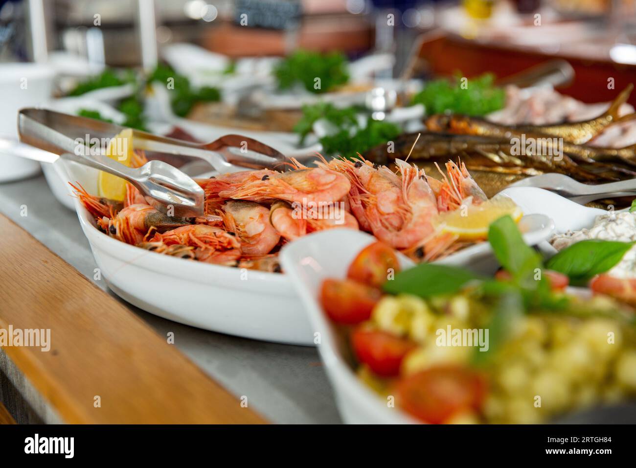 delicious shrimp on a serving plate on the buffet table in the ...