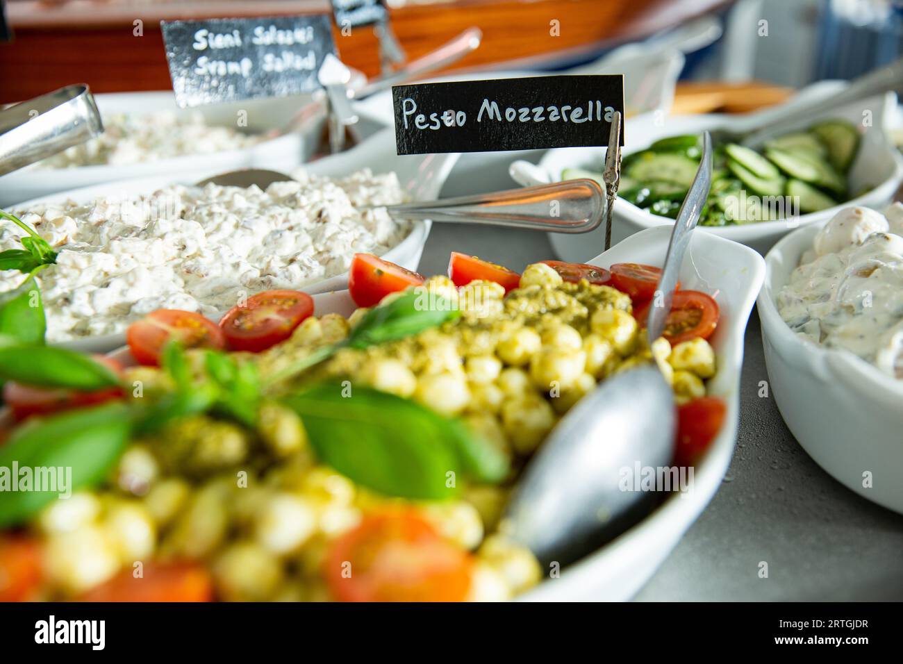 Cafe lunch buffet with pesto mozzarella salad. Healthy dinner in ...