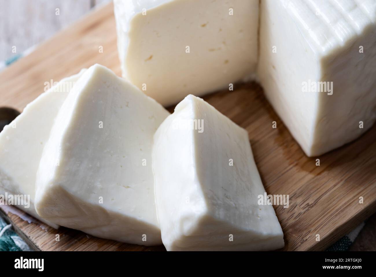 Sliced fresh white cheese from cow's milk on white background Stock ...