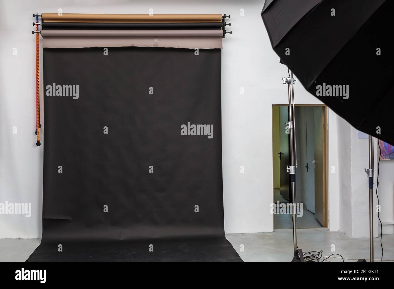 interior of bright space of photo studio with large black background ...