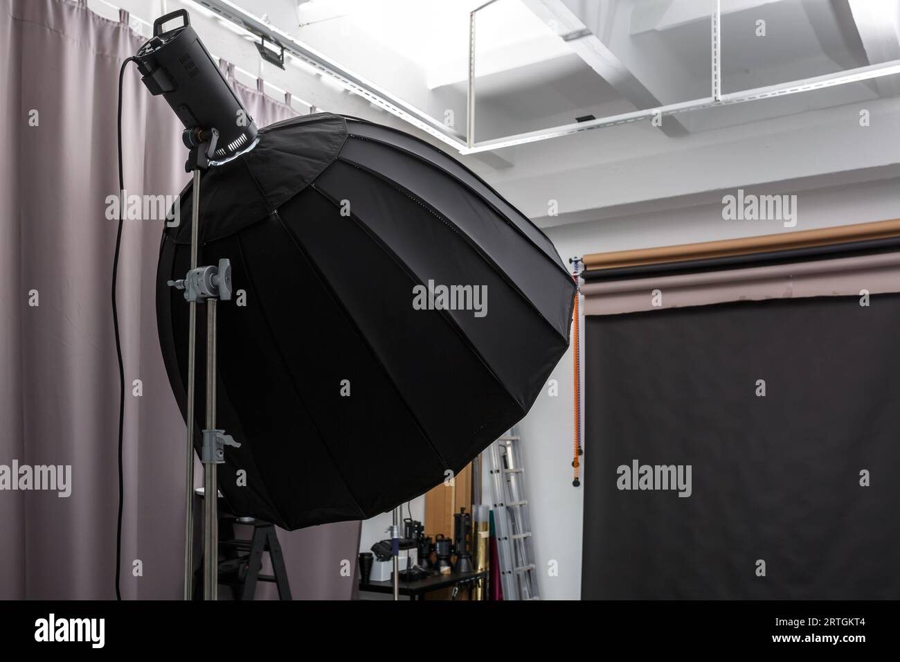 interior of bright space of photo studio with large black background ...