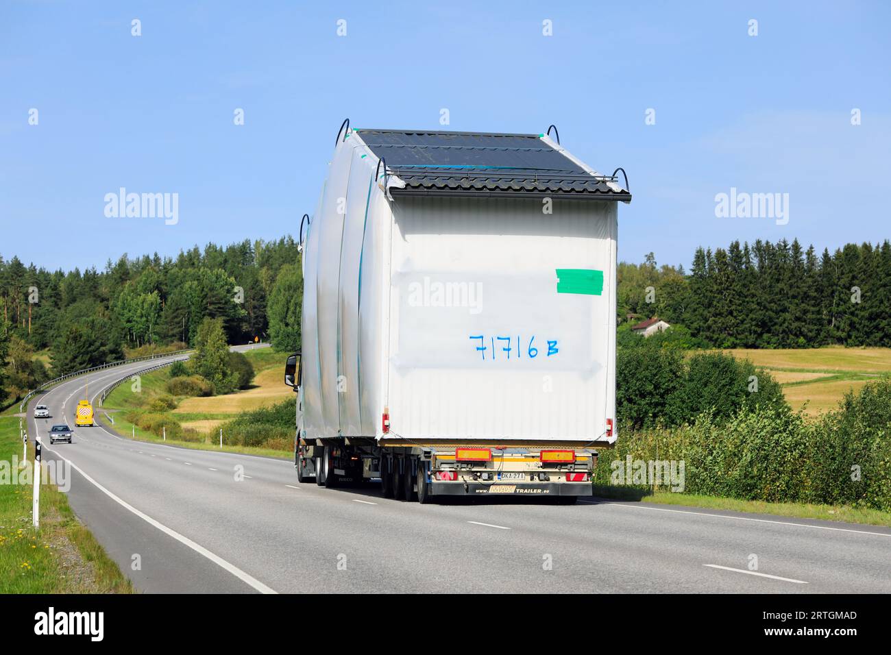 Oversize load transport of prefabricated cabin by truck semi trailer ...