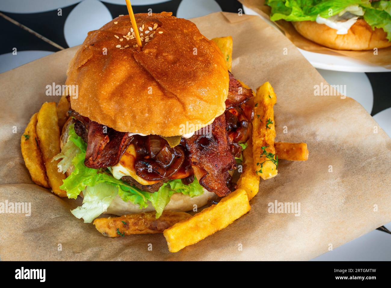 Scrumptious Beef Burger with loads of beacon, cheese, mayonnaise and ...