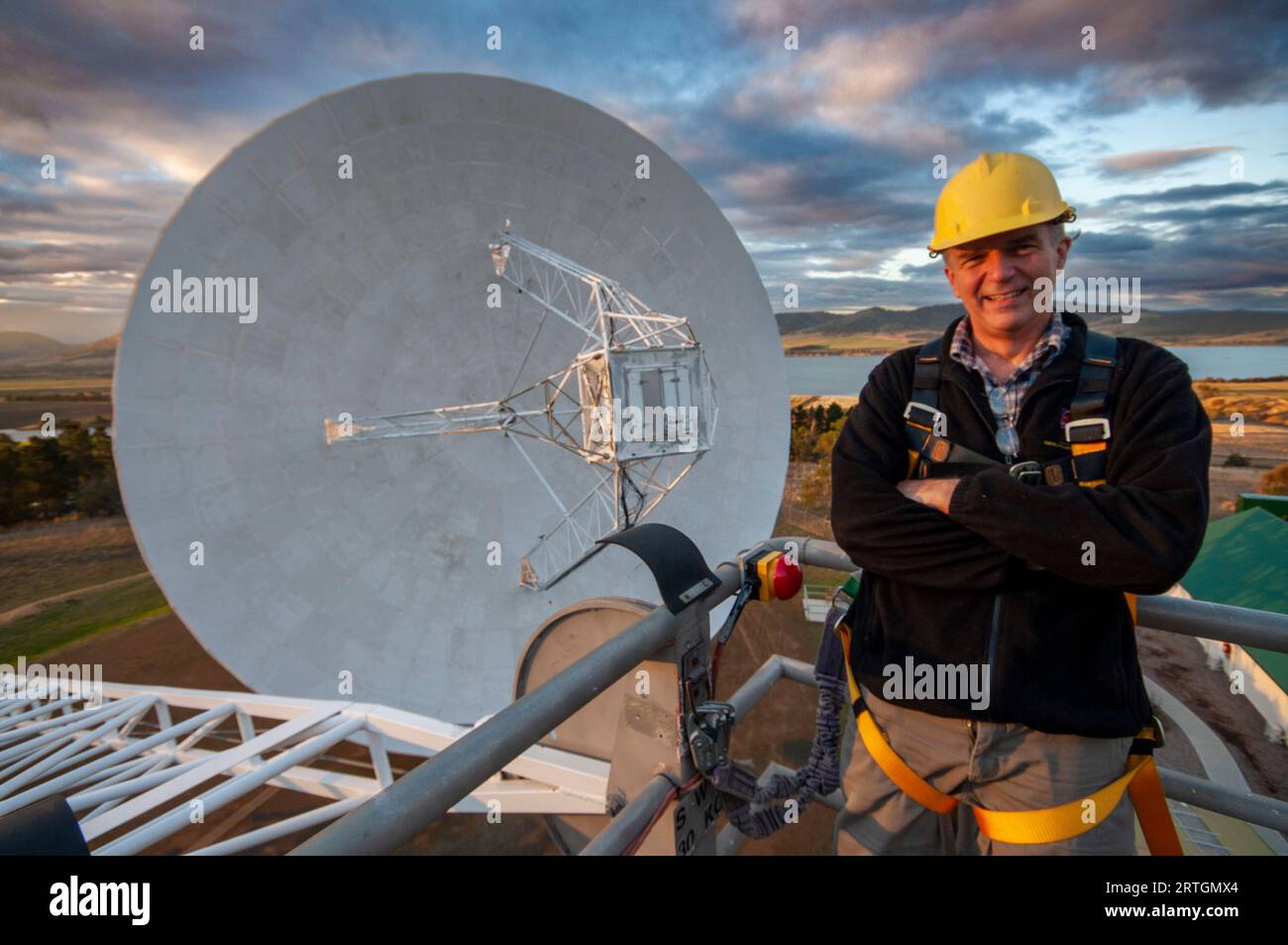 Brett Reid, Observatory Manager on a cherry picker above the main dish ...