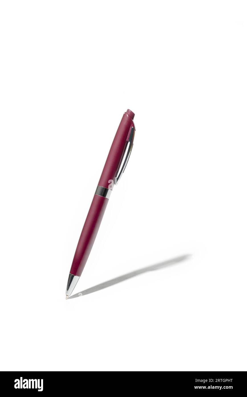 Detailed purple classic ballpoint pen writing on white surface with its ...