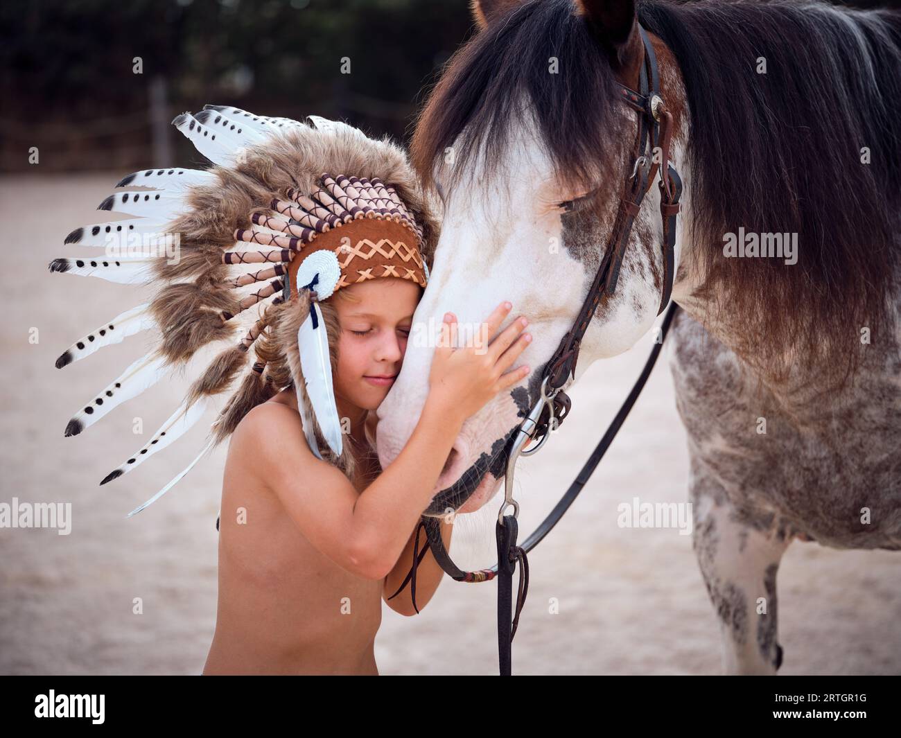 Side view of cute child with closed eyes wearing traditional Indian ...