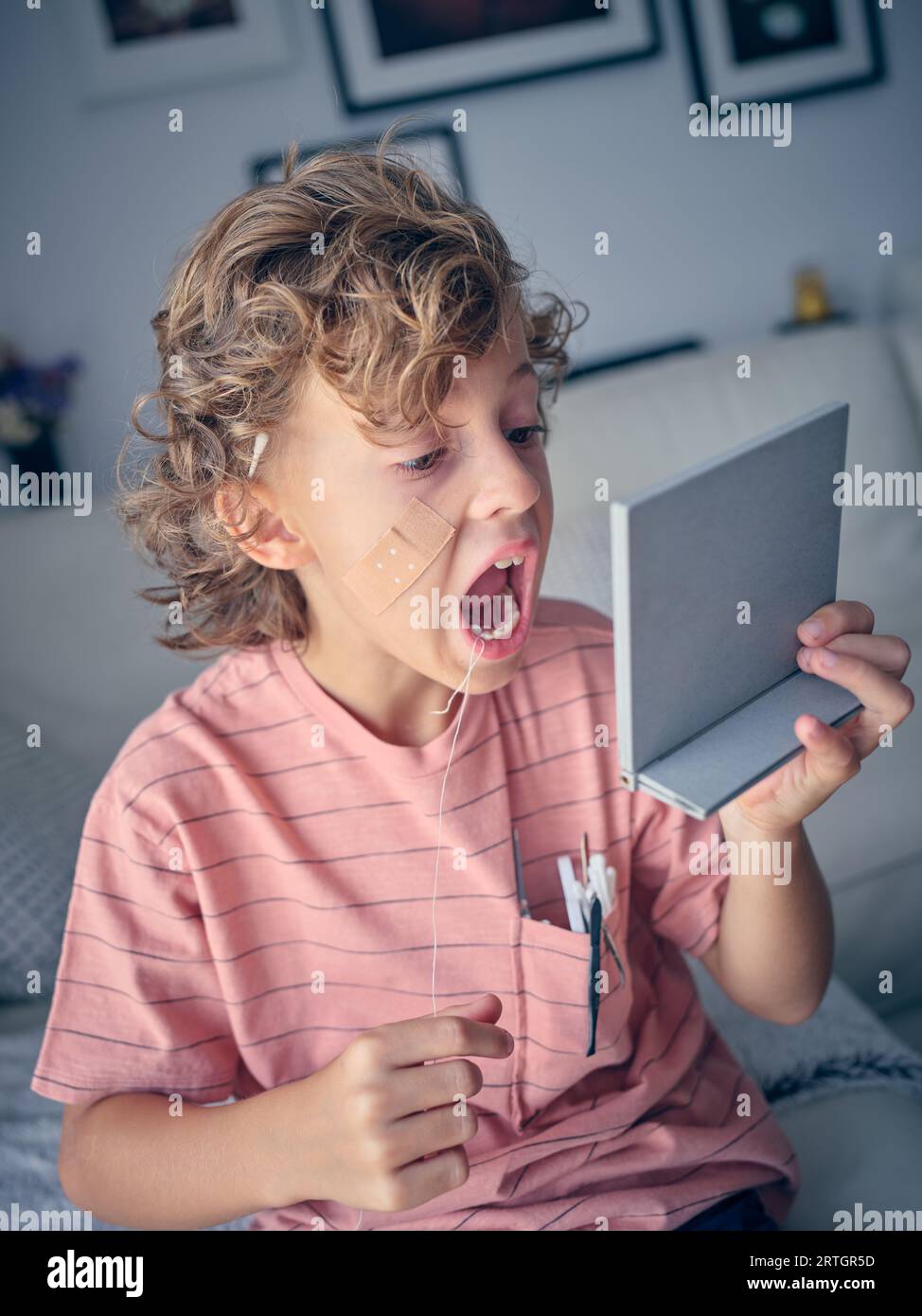 Kid pulling shirt hi-res stock photography and images - Alamy