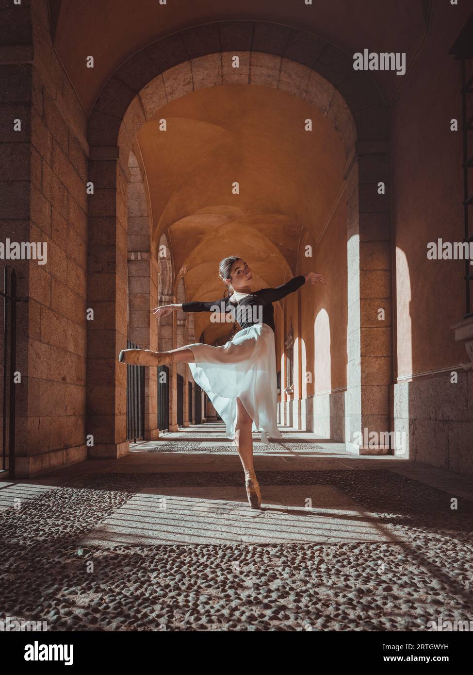 Side view of full body of young gracious female ballet dancer ...