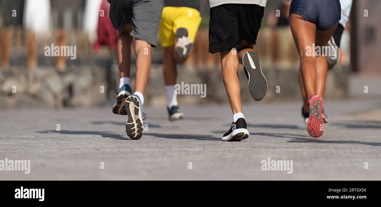 Running children, young athletes run in a kids run race, running on ...