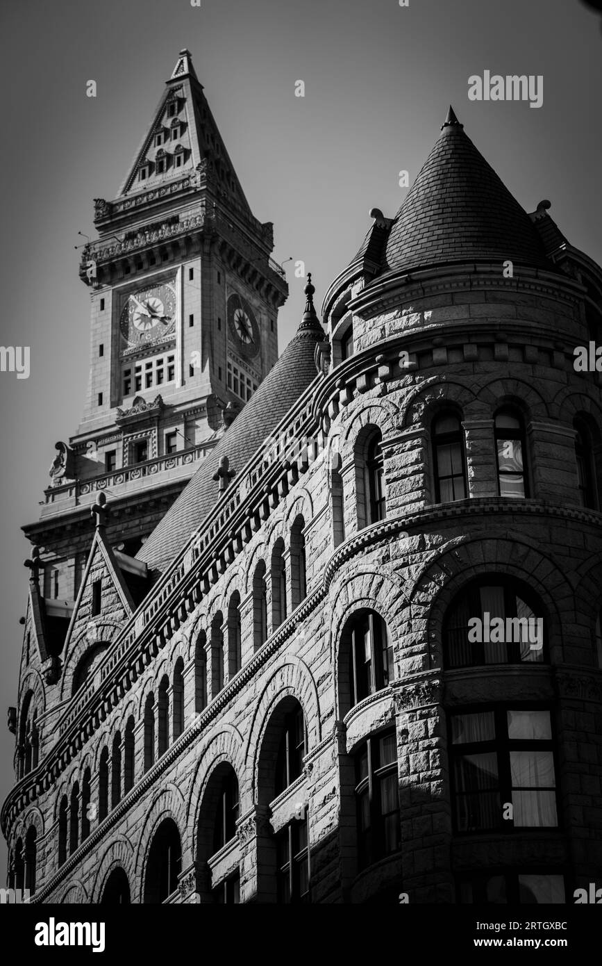 A low angle of an old clock tower in Boston, USA in grayscale Stock ...