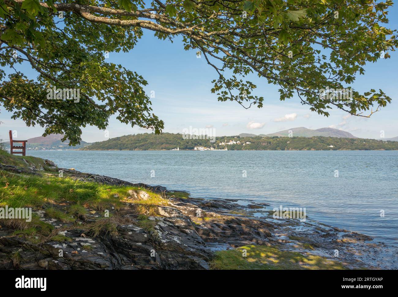 Traeth Bach with blue sky and calm sea Stock Photo - Alamy