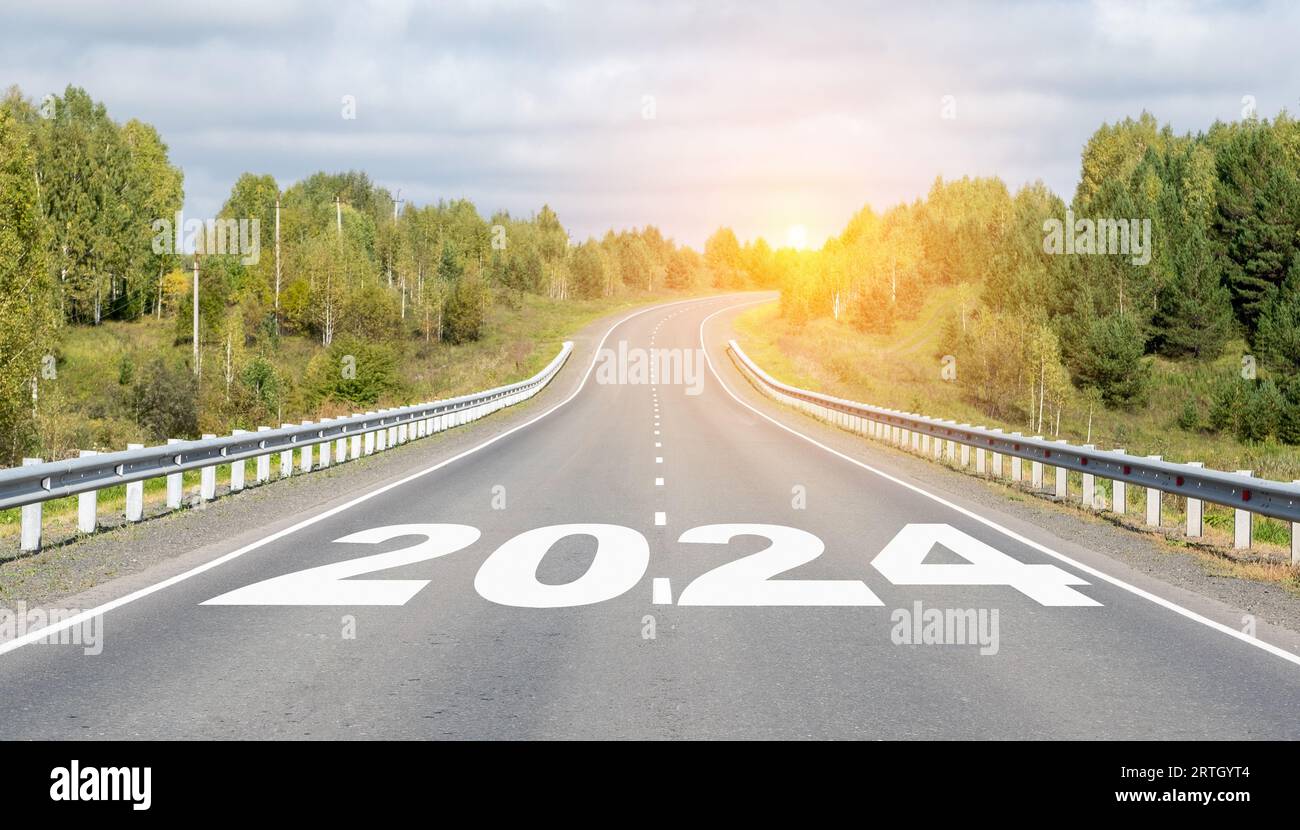 2024 written on highway road in the middle of empty asphalt road Stock ...