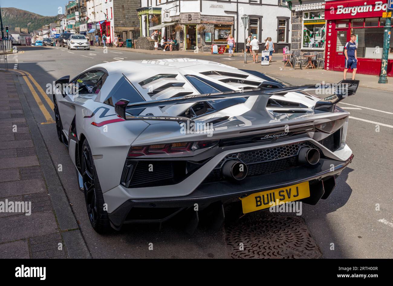 White Lamborghini Aventador SVJ sports car parked on the road in ...