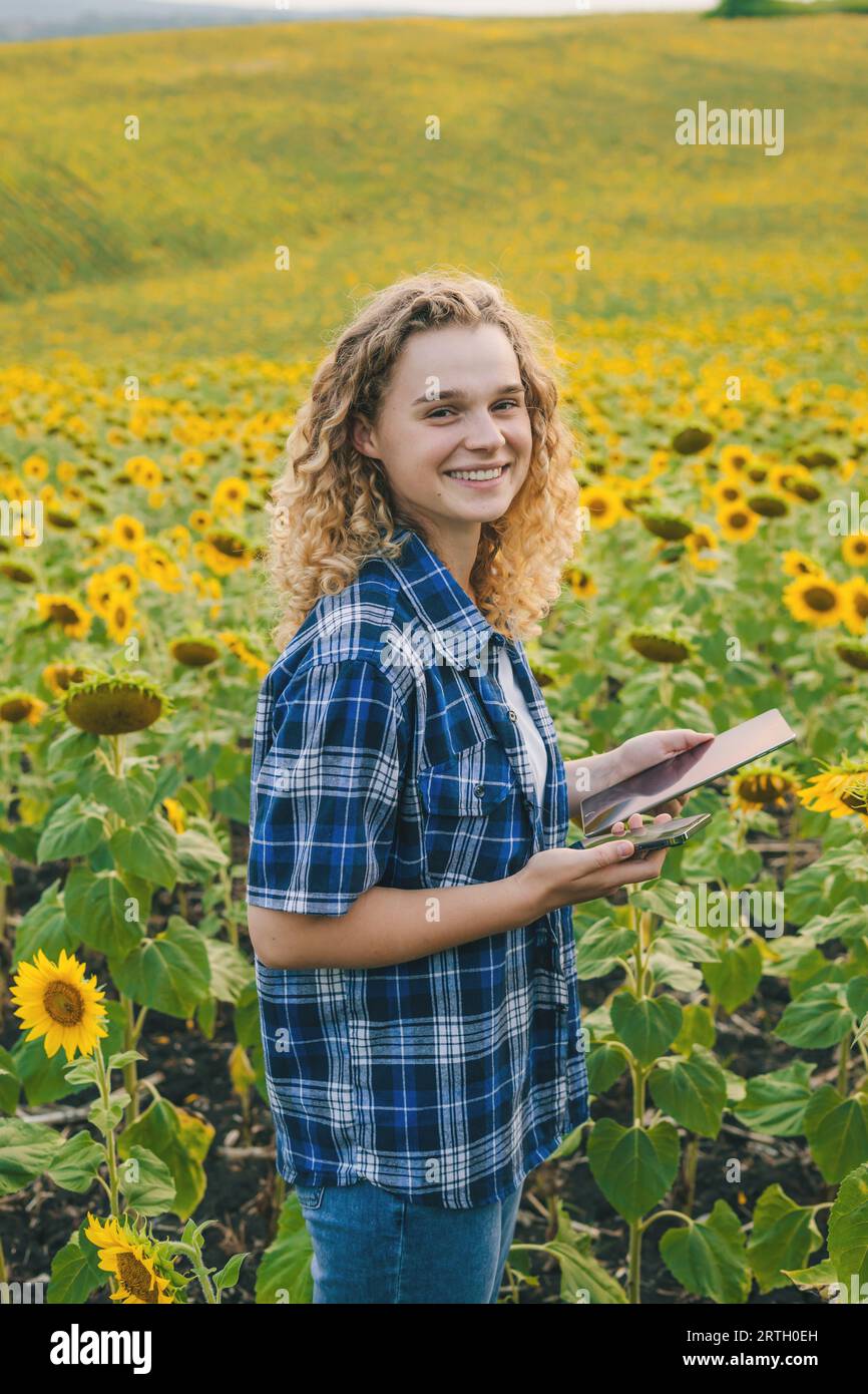 Farmer working with tablet in farm, business agriculture. Agronomist ...